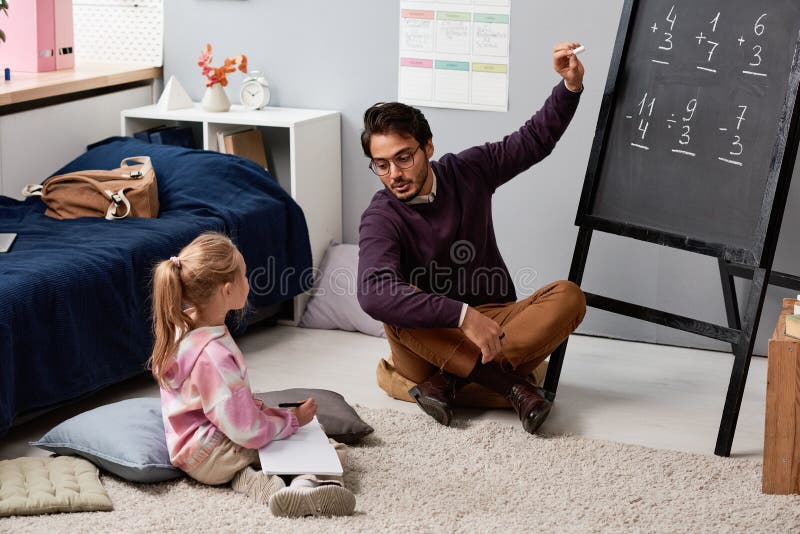 Math Tutor Explaining Rule To Girl Stock Image - Image of flooring ...