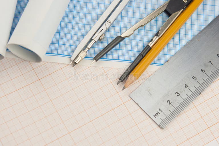 Mathematical Instruments Over the Corner of a Math Graph Paper with ...