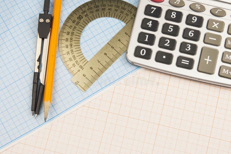 Mathematical Instruments Over the Corner of a Math Graph Paper with ...