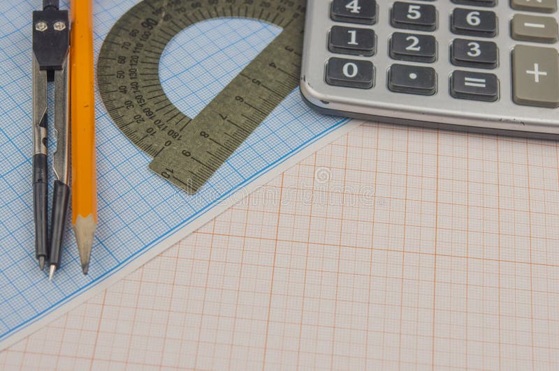 Mathematical Instruments Over the Corner of a Math Graph Paper with ...