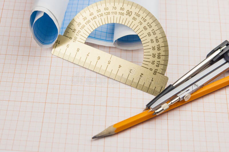 Mathematical Instruments Over the Corner of a Math Graph Paper with ...
