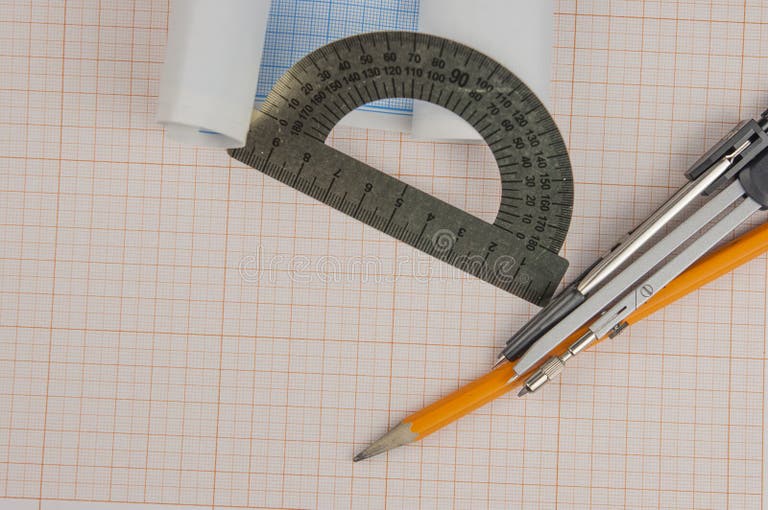 Mathematical Instruments Over the Corner of a Math Graph Paper with ...