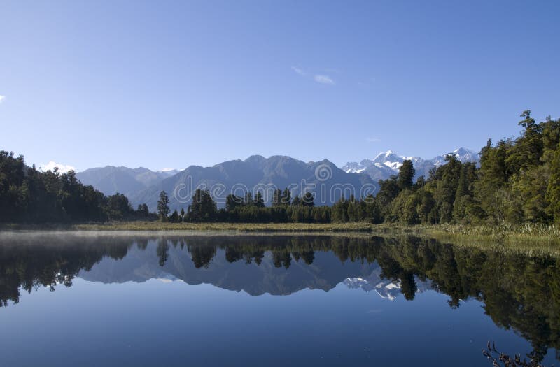 Reflection on Lake Matheson, New Zealand Stock Photo - Image of lake ...