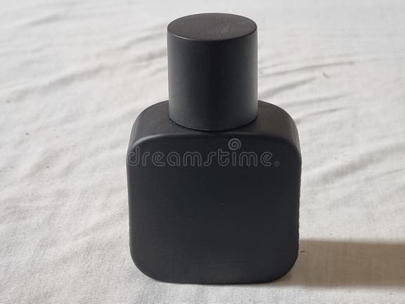 A Matte Black Rectangular Perfume Bottle with Rounded Edges and a ...