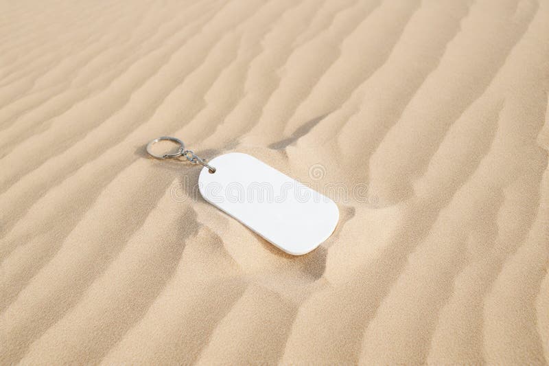 Matte White Keychain on Smooth Sand Dunes with Windswept Patterns Stock ...