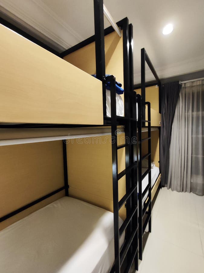 Bunk Beds are Neatly Arranged and Impeccably Clean, Each Adorned with a ...