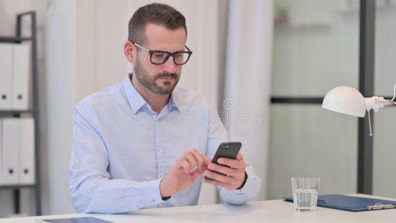 Middle Aged Man Using Smartphone at Work Stock Photo - Image of working ...
