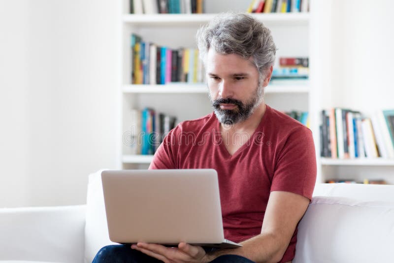 Mature Adult Man Working at Computer at Home Stock Photo - Image of ...