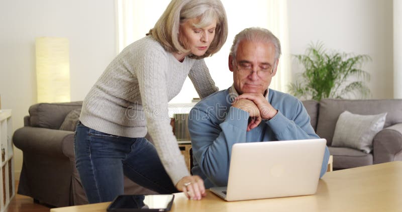 Mature Adults Learning How To Use Laptop Computer Together Stock Video ...