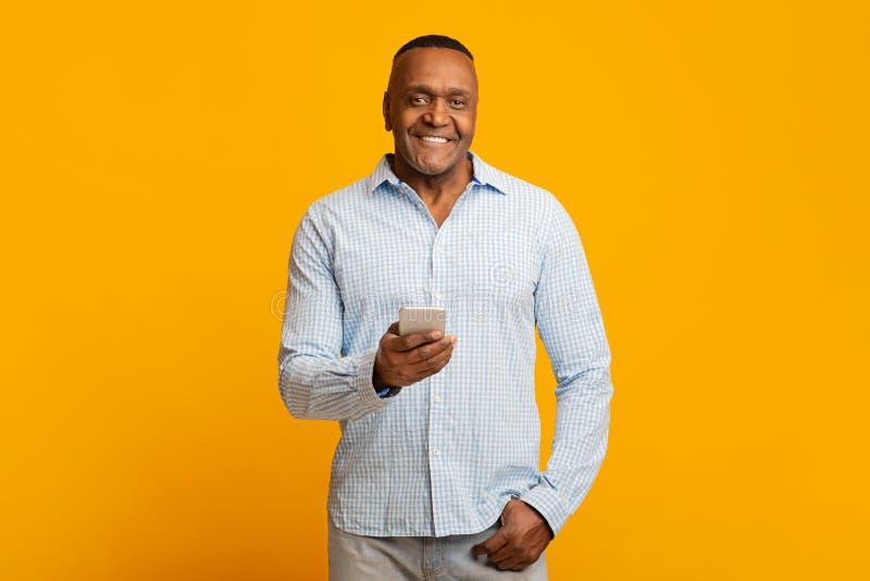 Mature African American Man Networking on Cellphone Stock Image - Image ...