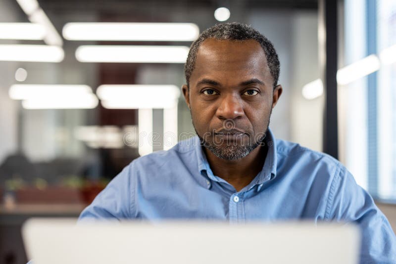 Mature African American Office Worker Focused at Workplace Inside ...