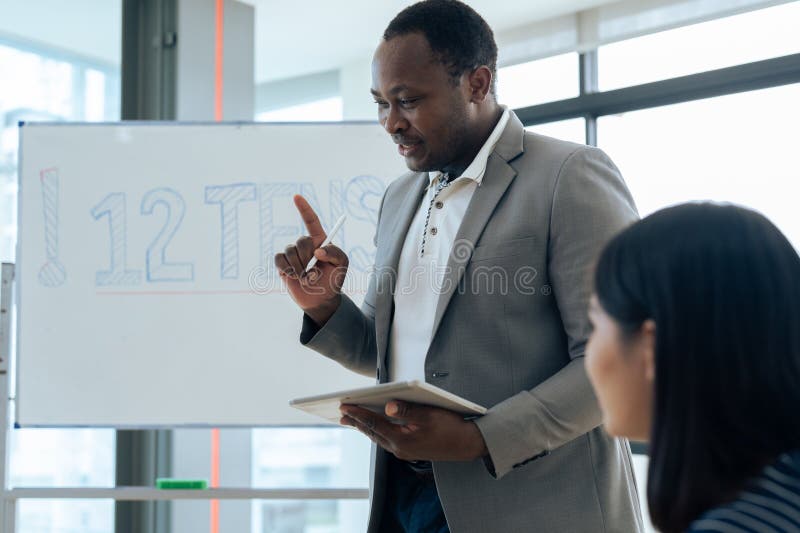 Mature African American Professor Talking To His Student while Teaching ...