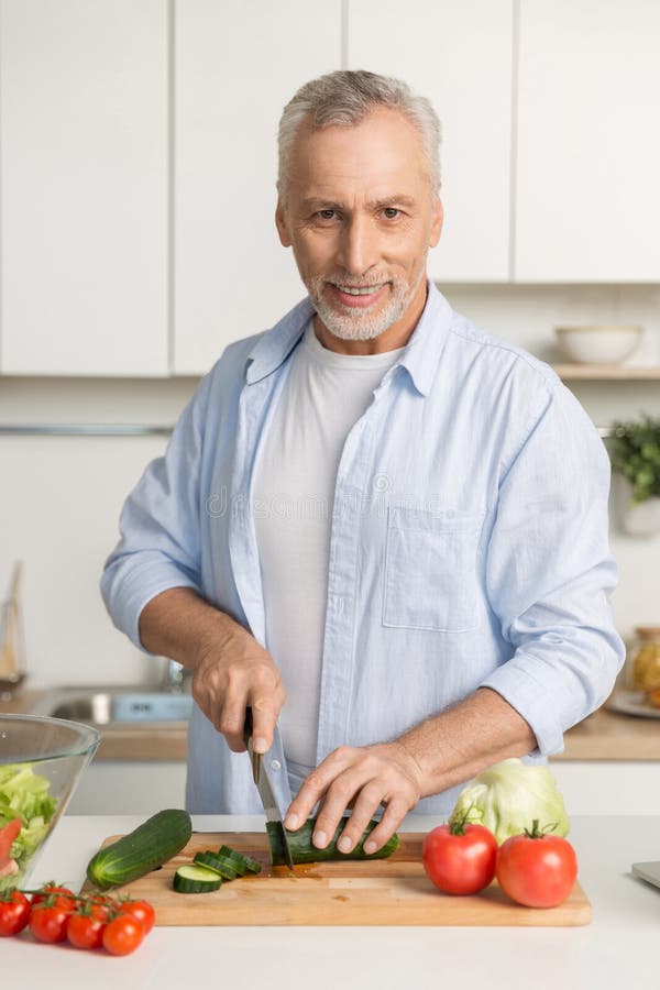 Mature Attractive Man Standing at the Kitchen Cooking Stock Image ...