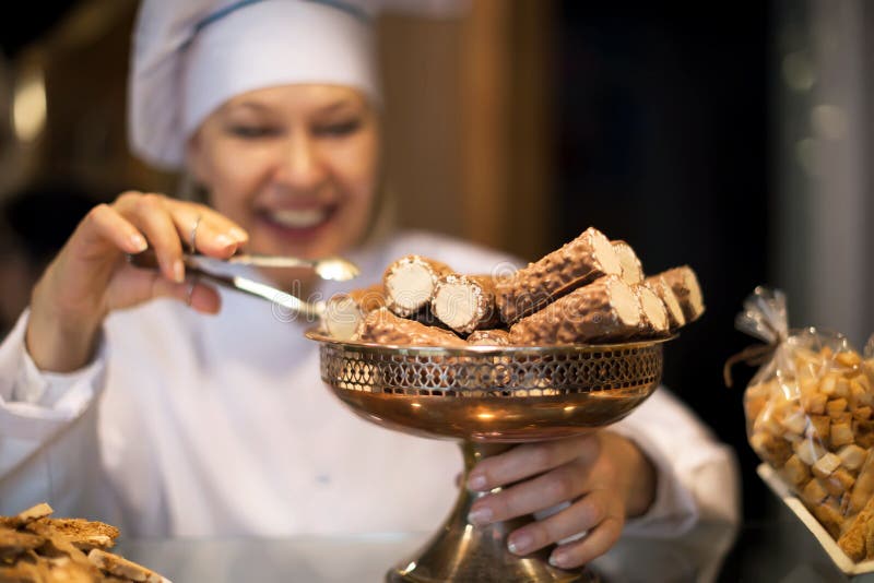 Mature Bakery Employee Working in Bakery with Different Pastry Stock ...