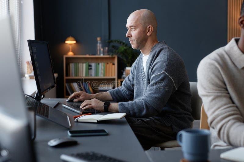 Mature Bald Man Typing on Keyboard of Desktop Computer while Working at ...