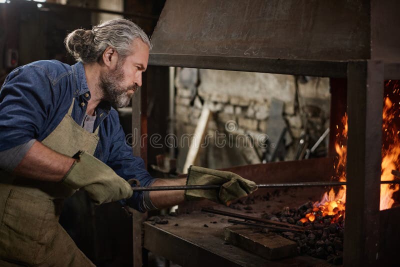 Iron Worker Working in the Workshop Stock Photo - Image of holding ...