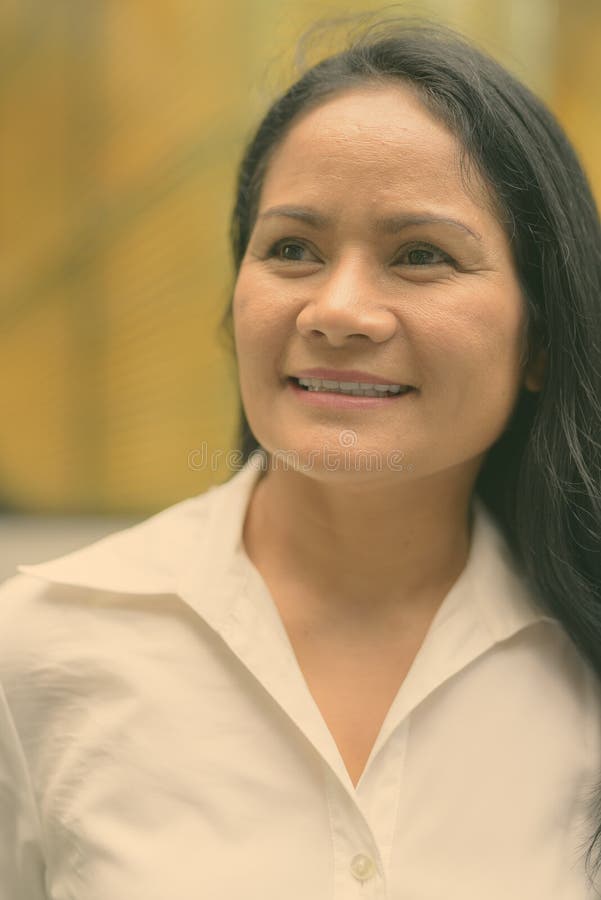 Mature Beautiful Asian Businesswoman Exploring The City Of Bangkok