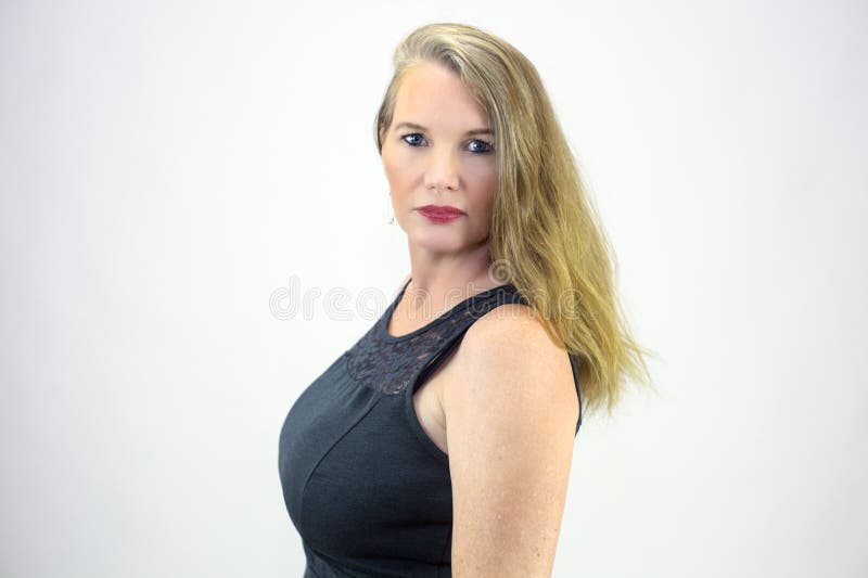 Mature Blonde Female Torso Shot Looking at Camera in Black Top Stock ...