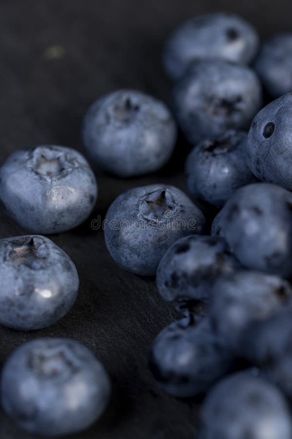 A Pile of Blueberries Scattered on the Board Stock Image - Image of ...