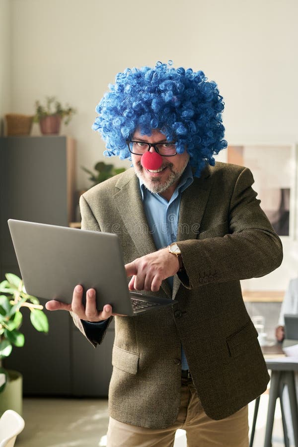 Mature Boss in Clown Wig Using Laptop Stock Photo - Image of manager ...
