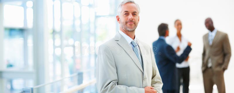 Mature Business Man with Other Staff at the Back Stock Image - Image of ...
