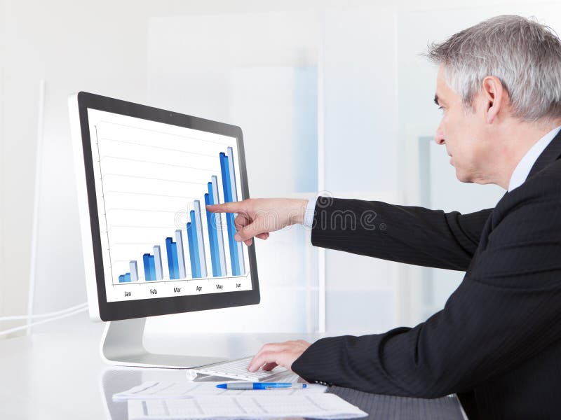 Mature Businessman Looking at Computer Stock Image - Image of gain ...