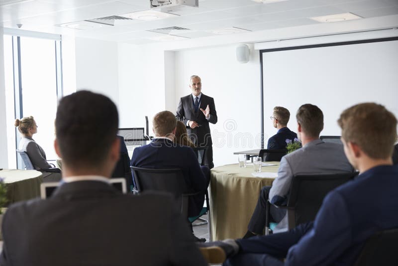 Mature Businessman Making Presentation at Conference Stock Photo ...