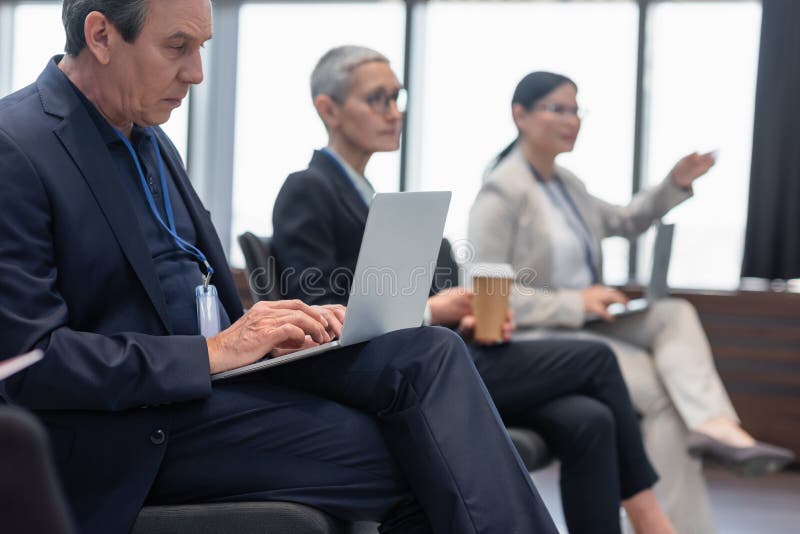 Mature Businessman Using Laptop in Conference Stock Photo - Image of ...