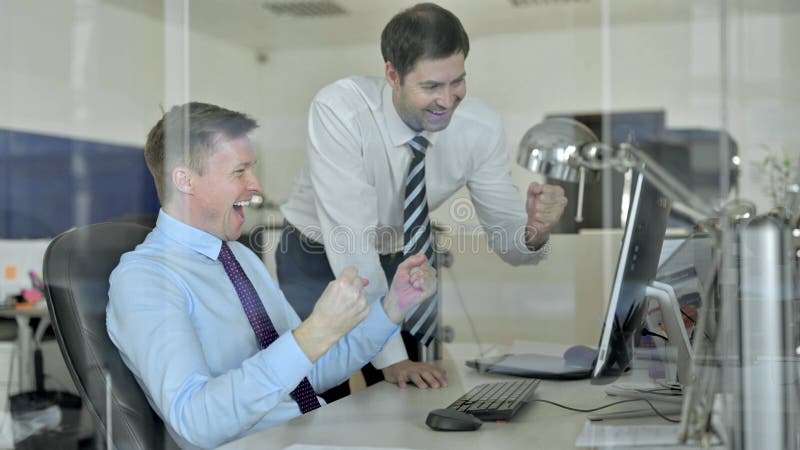 Mature Businessman Using Office Computer and Celebrating Success with ...