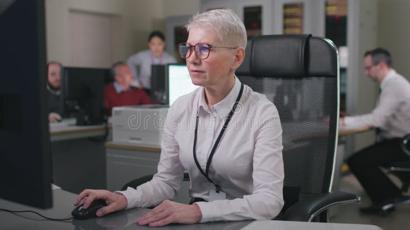 Mature Businesswoman Work on Computer Sitting at Desk in Office Stock ...