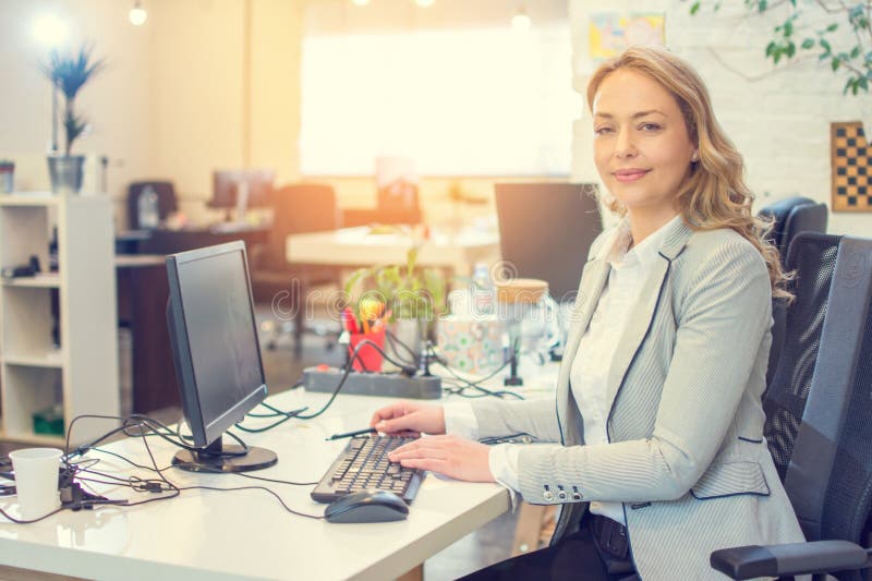 Mature Businesswoman Working on Computer in Office Stock Photo - Image ...