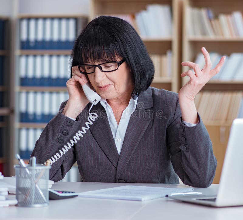 Mature Businesswoman Working in the Office Stock Photo - Image of ...