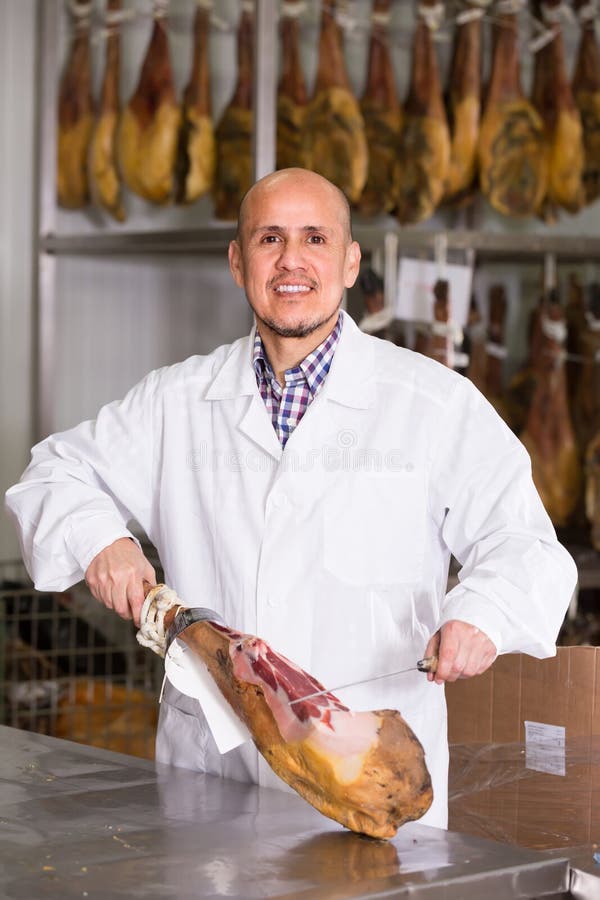 Mature Butcher Slicing Jamon at Store. Stock Image - Image of people ...