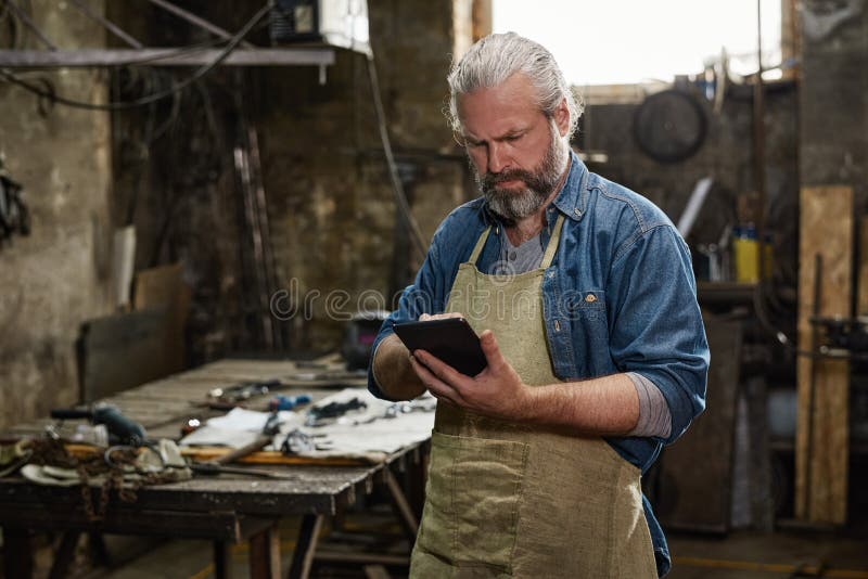 Carpenter Using Digital Tablet in His Work Stock Photo - Image of ...