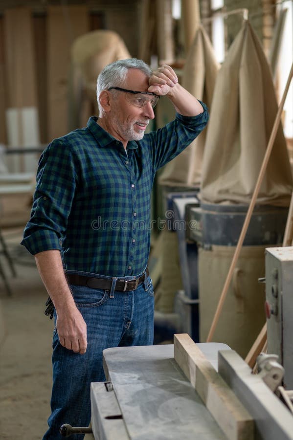 Mature Carpenter Working in a Workshop and Looking Tired Stock Photo ...