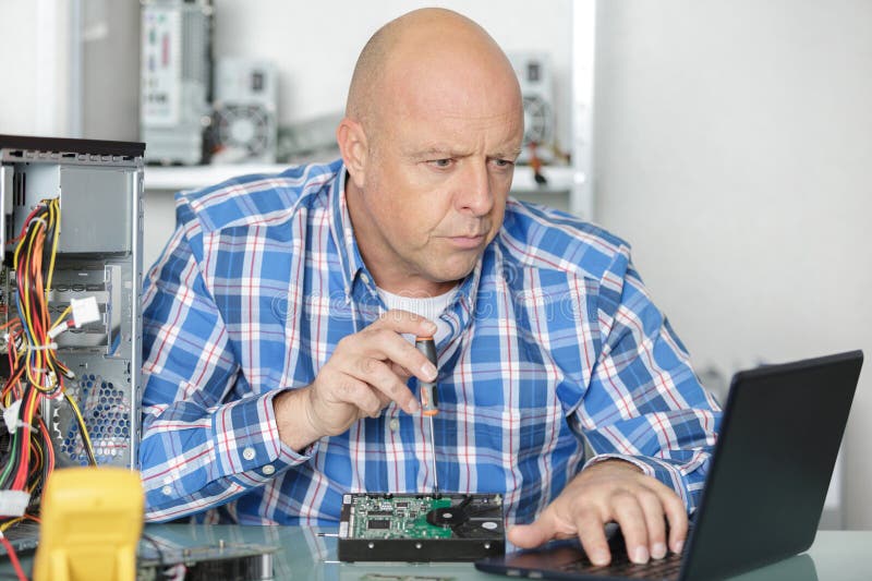Mature Computer Repairman Specialist Repairing Computer Desktop Stock ...