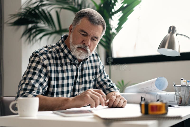 Mature Confident Smiling Architect in Casual Wear Working with ... Mature Confident Smiling Architect in Casual Wear Working with ...