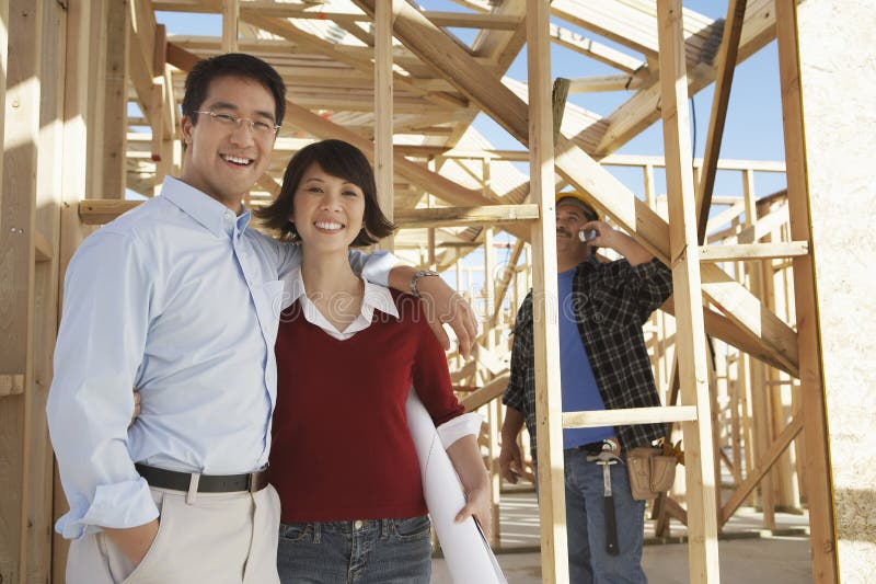 Couple with Architect at Construction Site Stock Photo - Image of ...