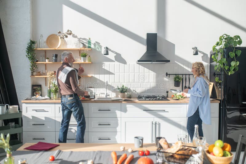 Mature Couple Cooking Breakfast Together Stock Photo - Image of kitchen ...