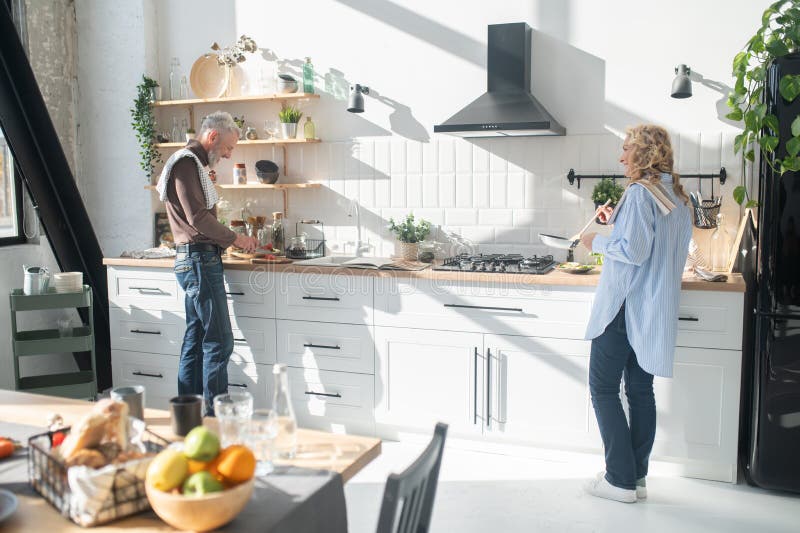 Mature Couple Cooking Breakfast Together Stock Photo - Image of ...