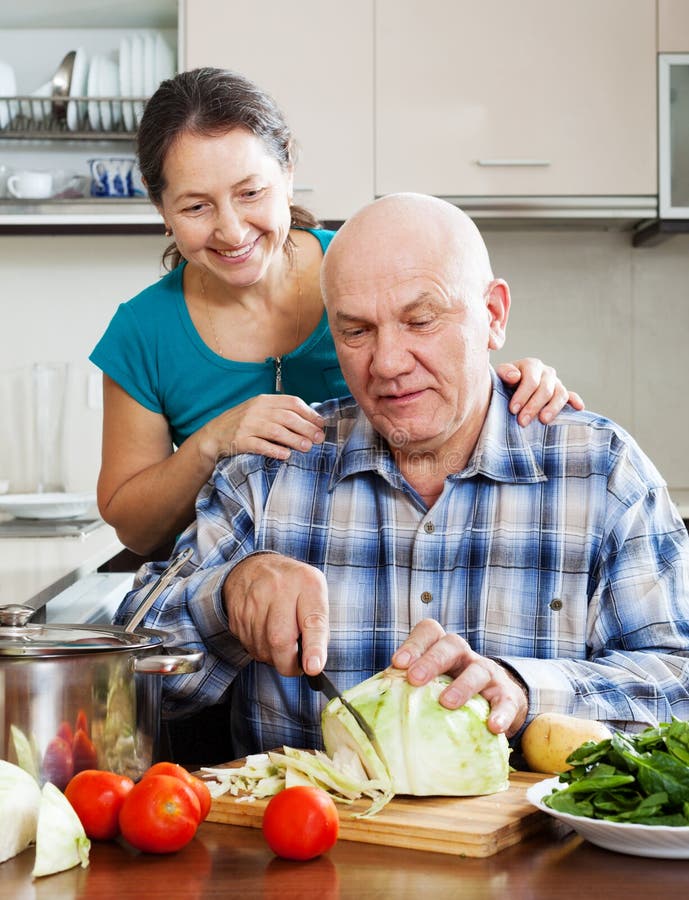 Mature Couple Cooking Food Together Stock Image - Image of healthy ...