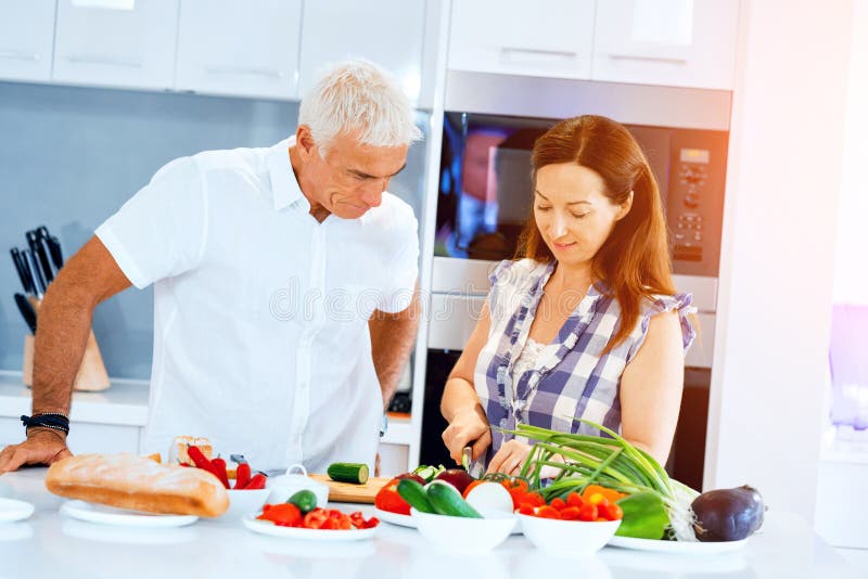 Mature Couple Cooking at Home Stock Image - Image of hobby, culinary ...