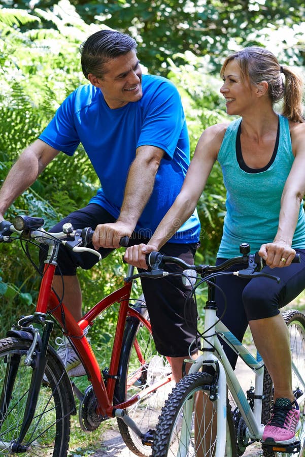 Mature Couple on Cycle Ride in Countryside Stock Photo - Image of ...