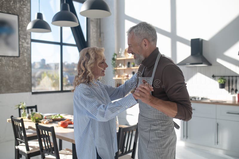 A Mature Couple Dancing in the Kitchen Stock Image - Image of indoors ...