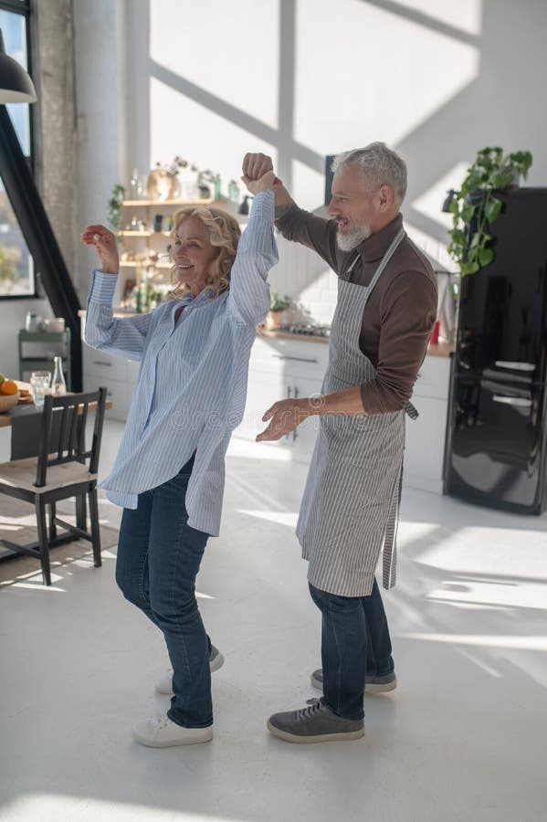 A Mature Couple Dancing in the Kitchen Stock Image - Image of interior ...