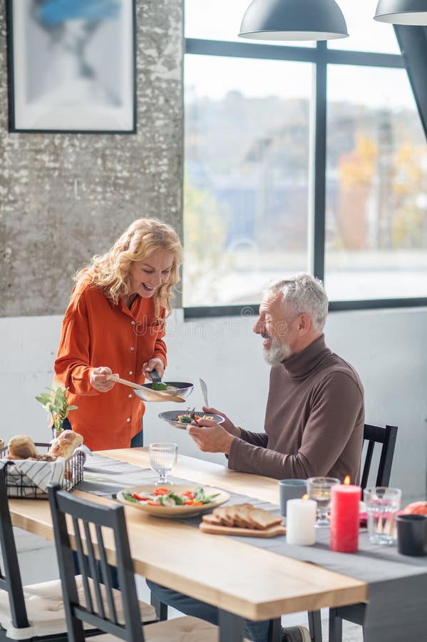 Mature Couple Having a Dinner and Looking Happy Stock Image - Image of ...