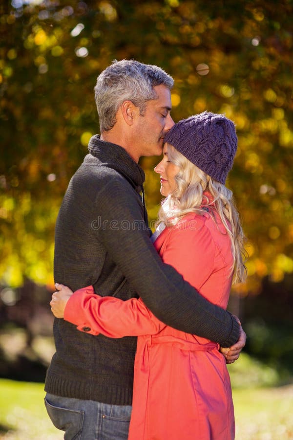 Mature Couple Hugging at Park Stock Image - Image of male, bonding ...
