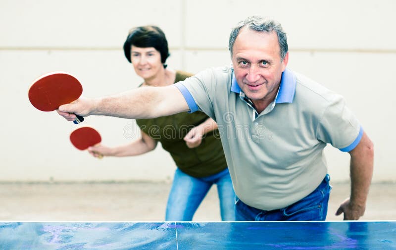 Mature Couple Playing Ping Pong Stock Image - Image of middleaged, ping ...