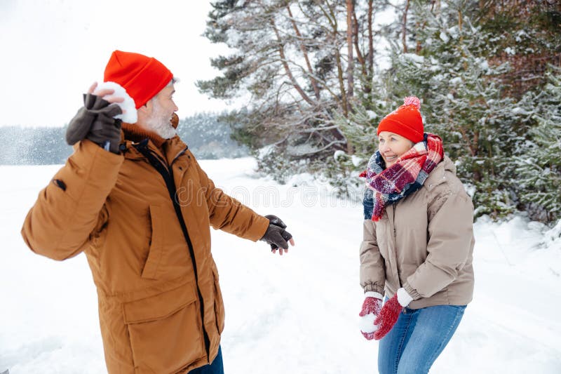 Mature Couple Playing Snowballs and Looking Enjoyed Stock Photo - Image ...