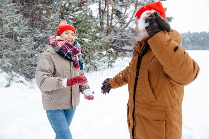 Mature Couple Playing Snowballs and Looking Enjoyed Stock Photo - Image ...